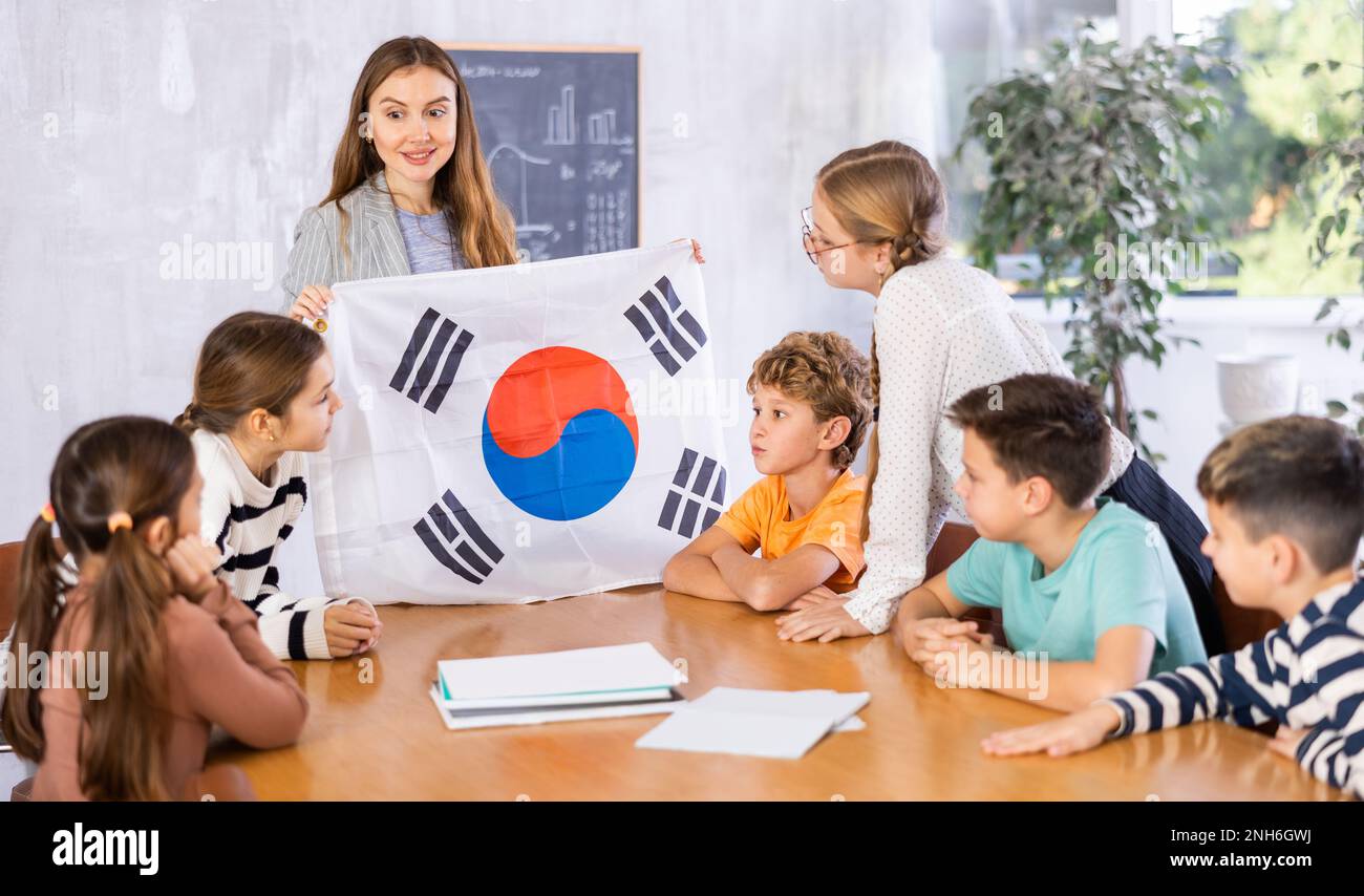 Schoolchildren listen carefully to story about the country South Korea ...