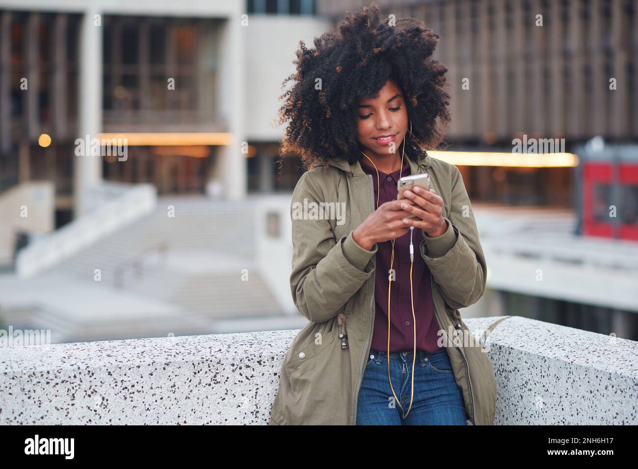 Black woman, city and texting with afro, smartphone ux and reading for ...