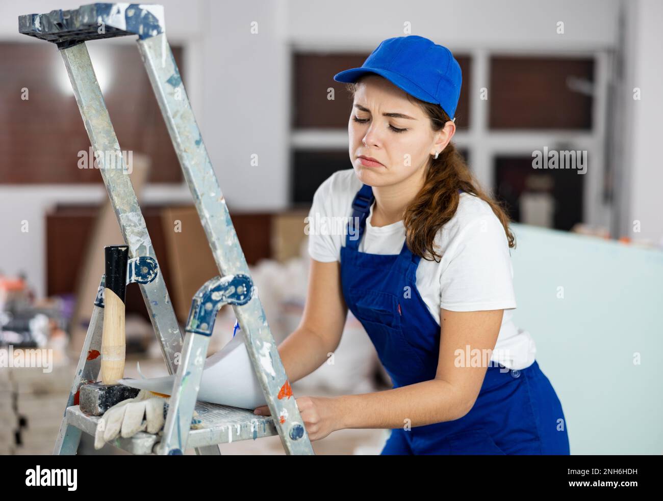 Young woman builder filling documentation in construction site Stock ...