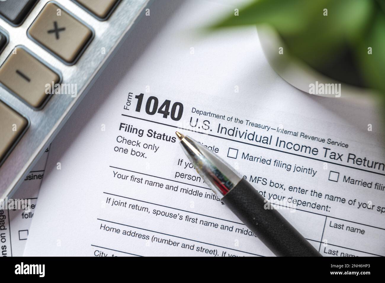 Financial time tax return forms with pen and calculator Stock Photo - Alamy