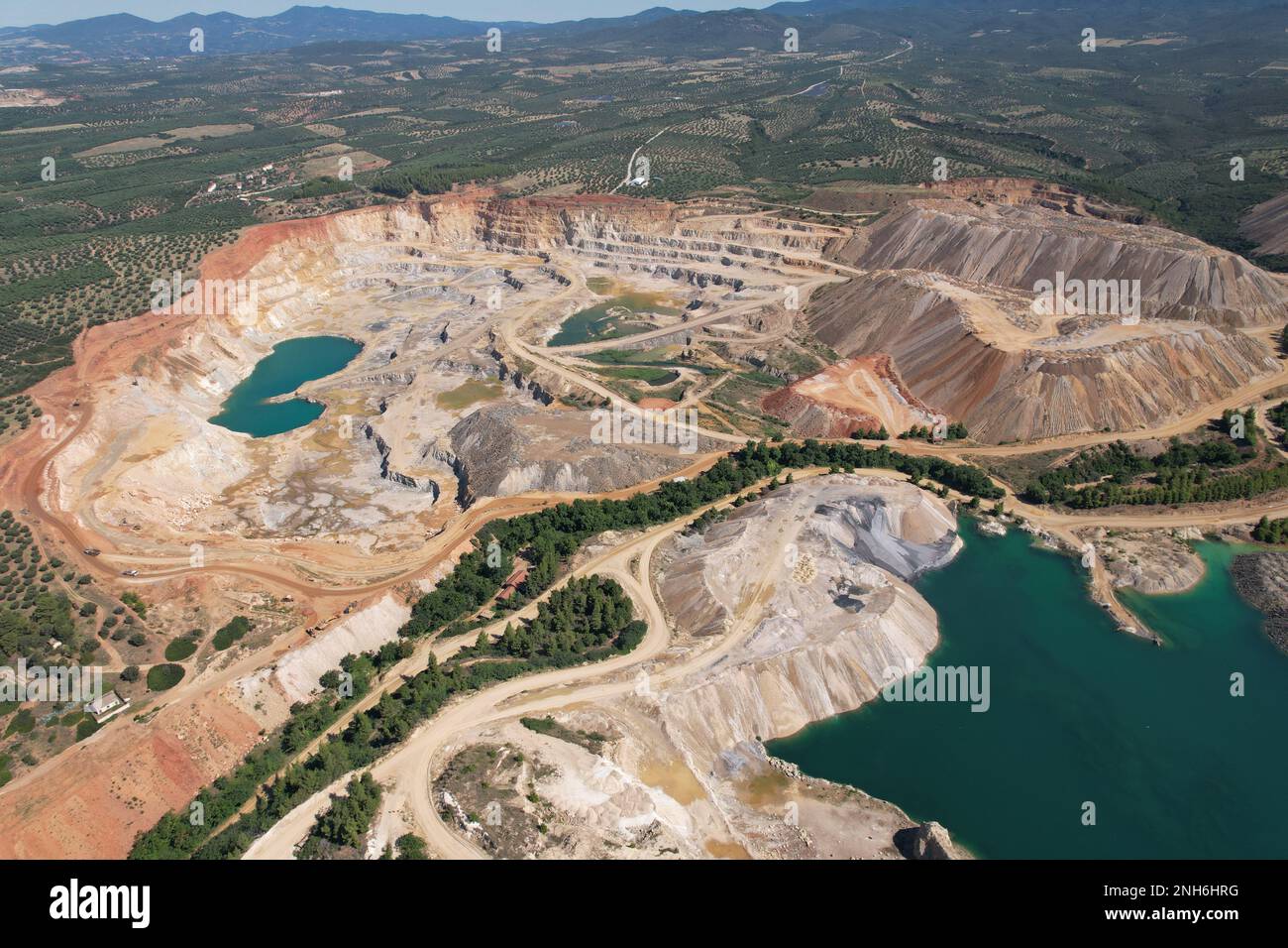 Panoramic aerial view of industrial terraces on open pit mineral mine ...