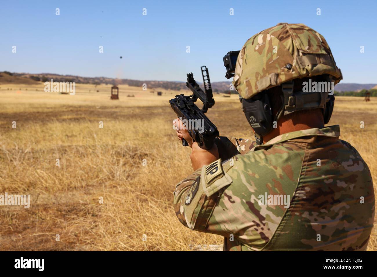 Soldiers in the 870th Military Police Company fire the M320 at Camp ...