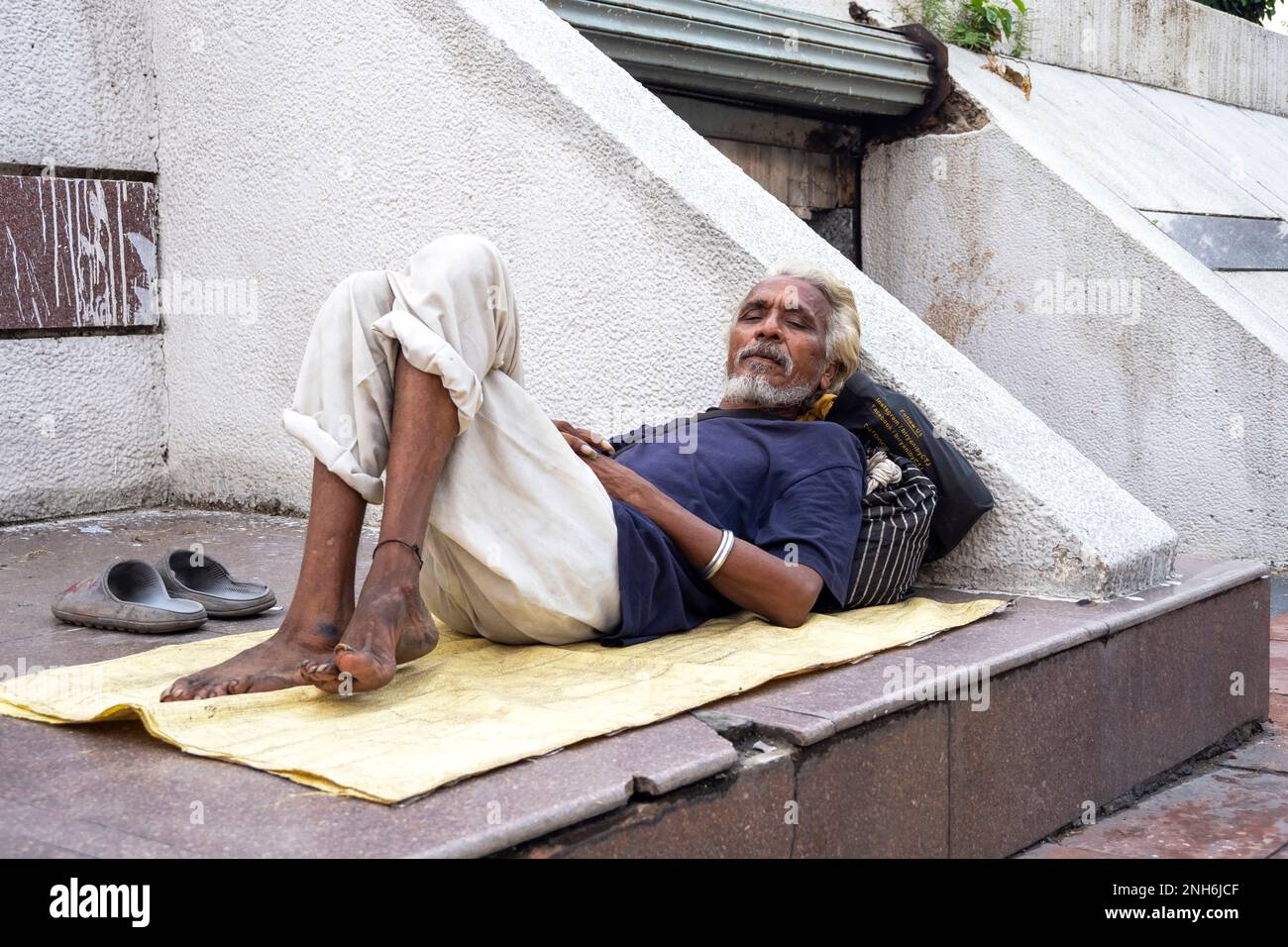 NEW DELHI - SEPT 16: Person lying on the ground and looking to the ...
