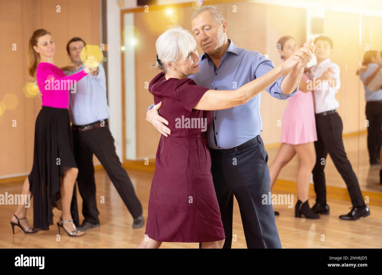 Elderly pair practicing ballroom dance in dance studio Stock Photo - Alamy
