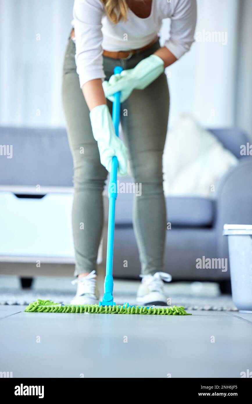 Mop, cleaner and woman cleaning floor with disinfection and hygiene ...