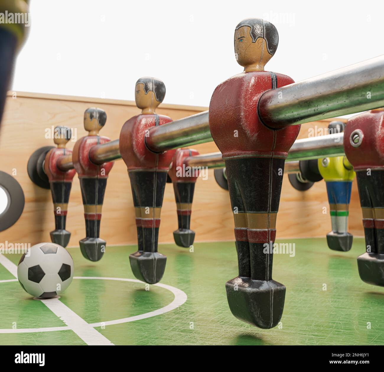 A vintage wooden foosball table with detailed metal player figurines in ...