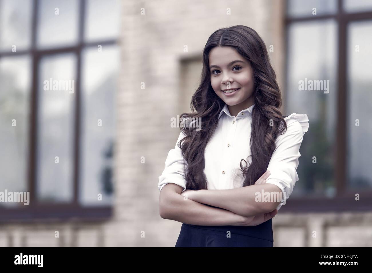 Believe and achieve. Confident look of cute child wearing uniform ...