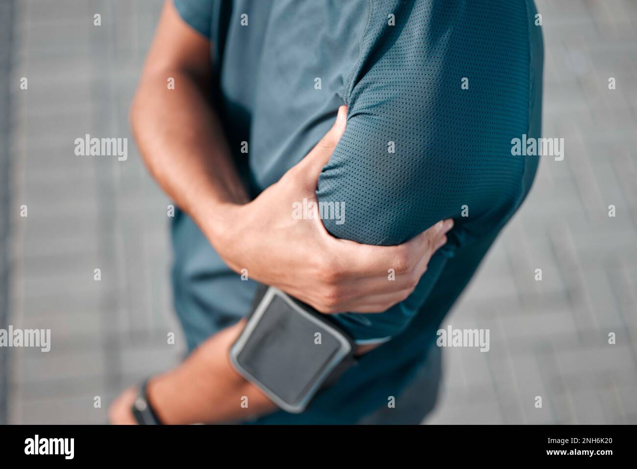 Man, shoulder pain and closeup for training outdoor, exercise and ...