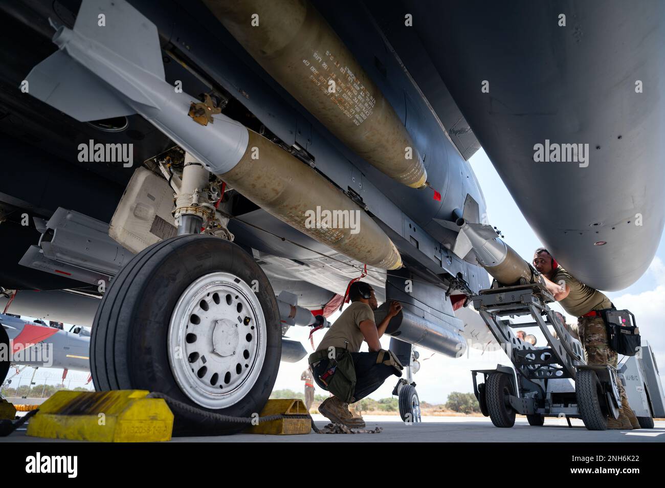 U.S. Air Force weapons load team members assigned to the 48th Aircraft ...