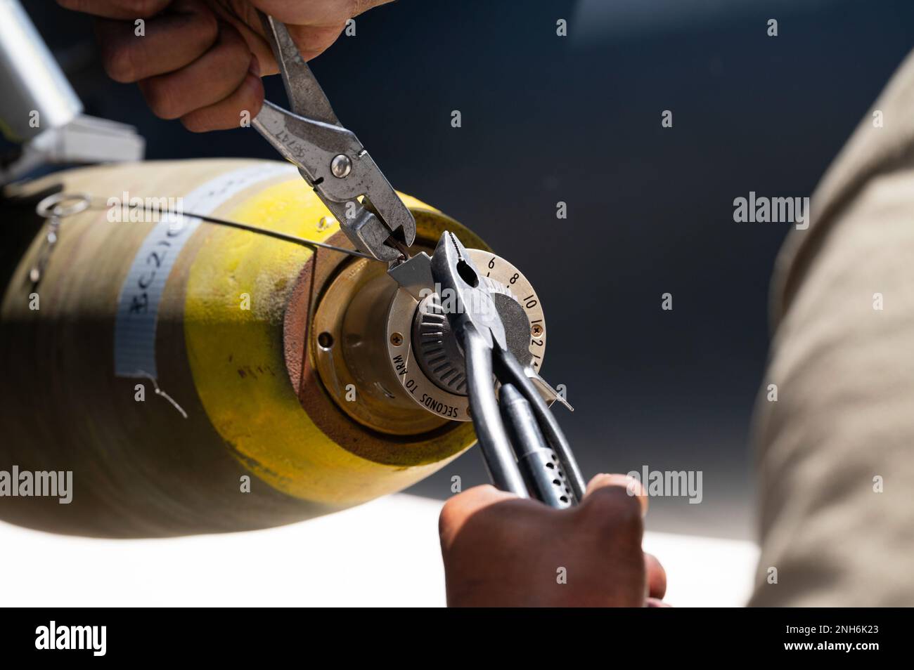 A U.S. Air Force weapons load crew member assigned to the 48th Aircraft ...