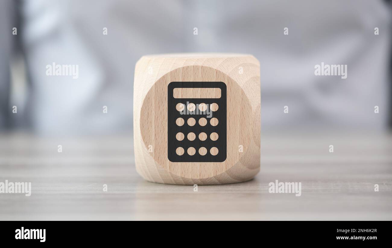 Wooden block with symbol of accounting concept Stock Photo - Alamy