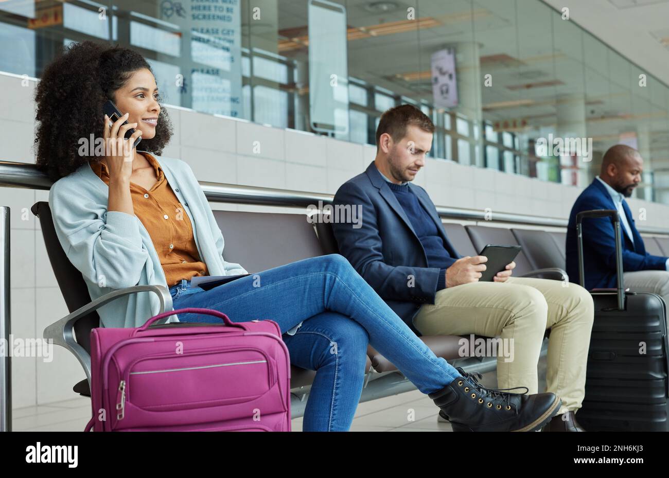 Black woman, phone call and airport in waiting room for conversation ...