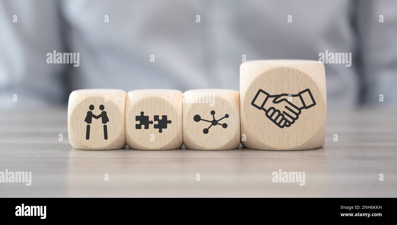 Wooden blocks with symbol of collaboration concept Stock Photo - Alamy