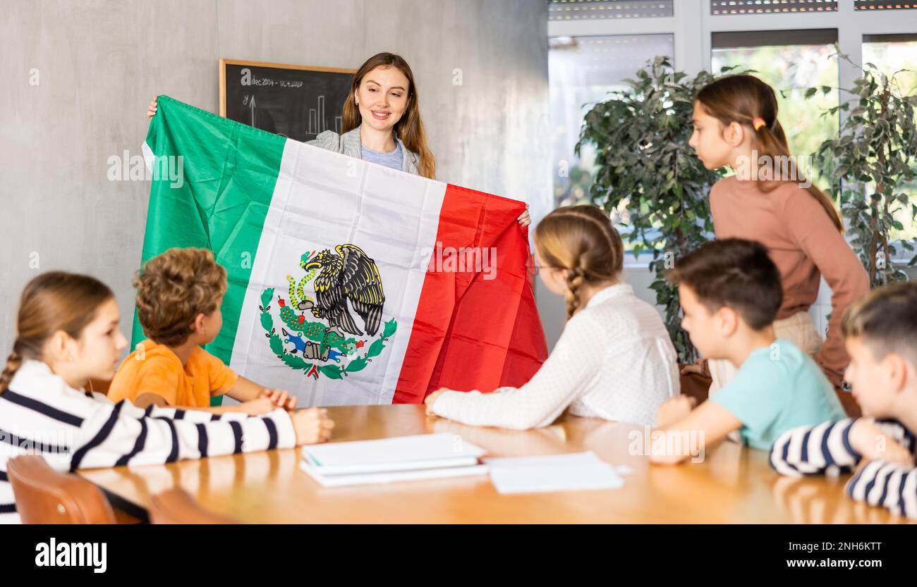 Female teacher, conducting extracurricular lesson in the school class ...