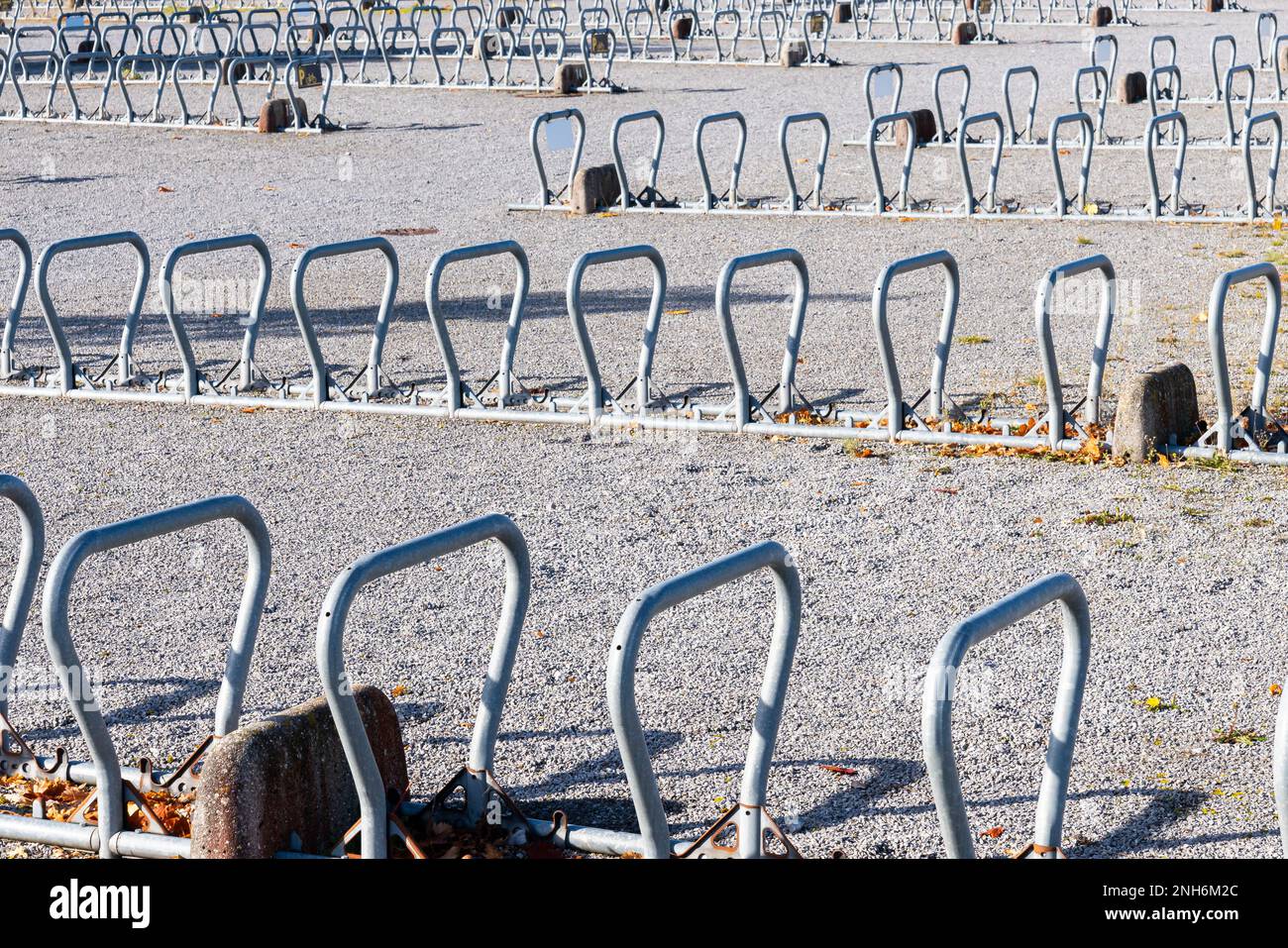 Large group of modern bike racks in bracket shape on a large public ...