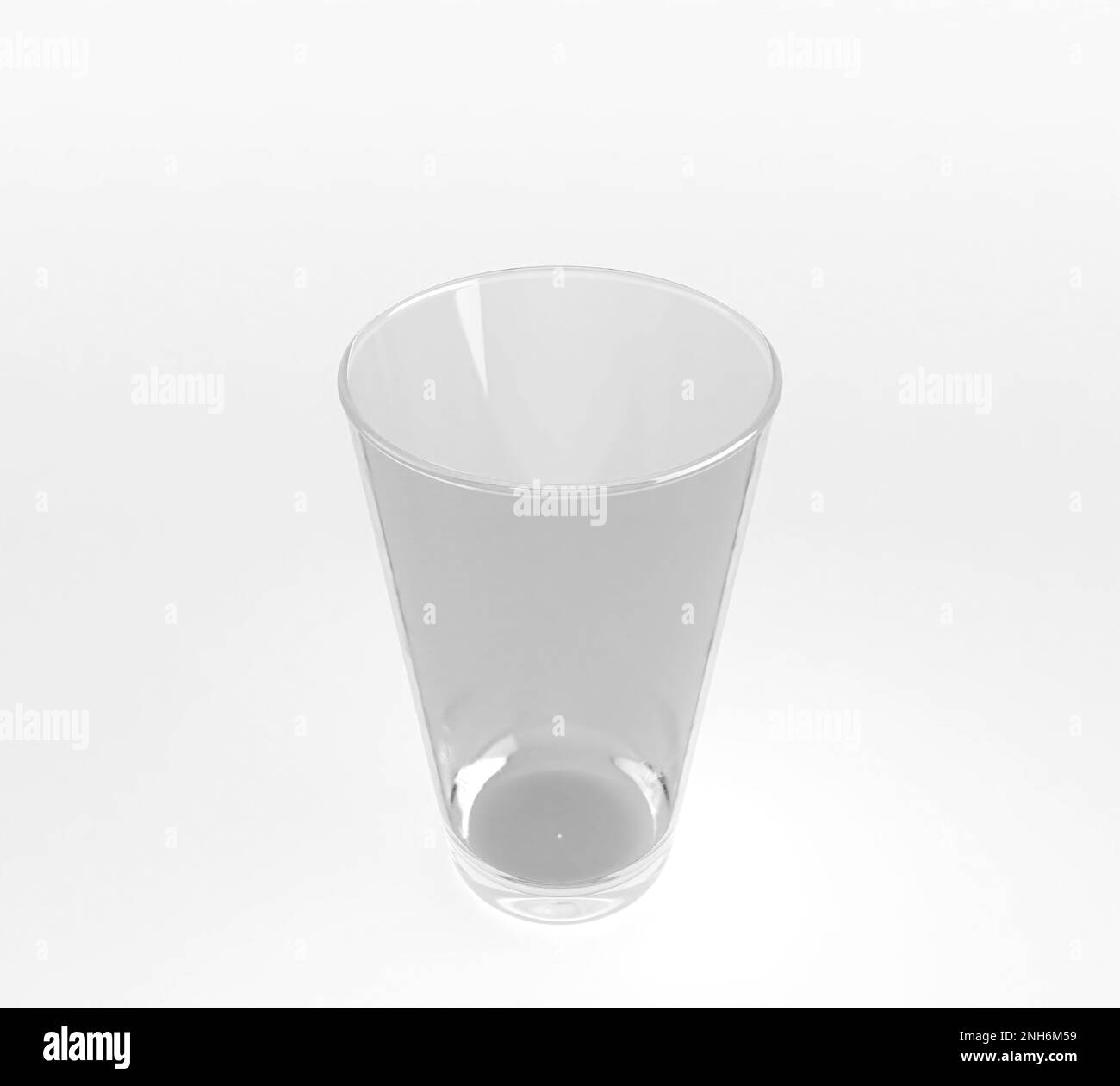 An empty shaker shaped beer glass an isolated white studio background ...