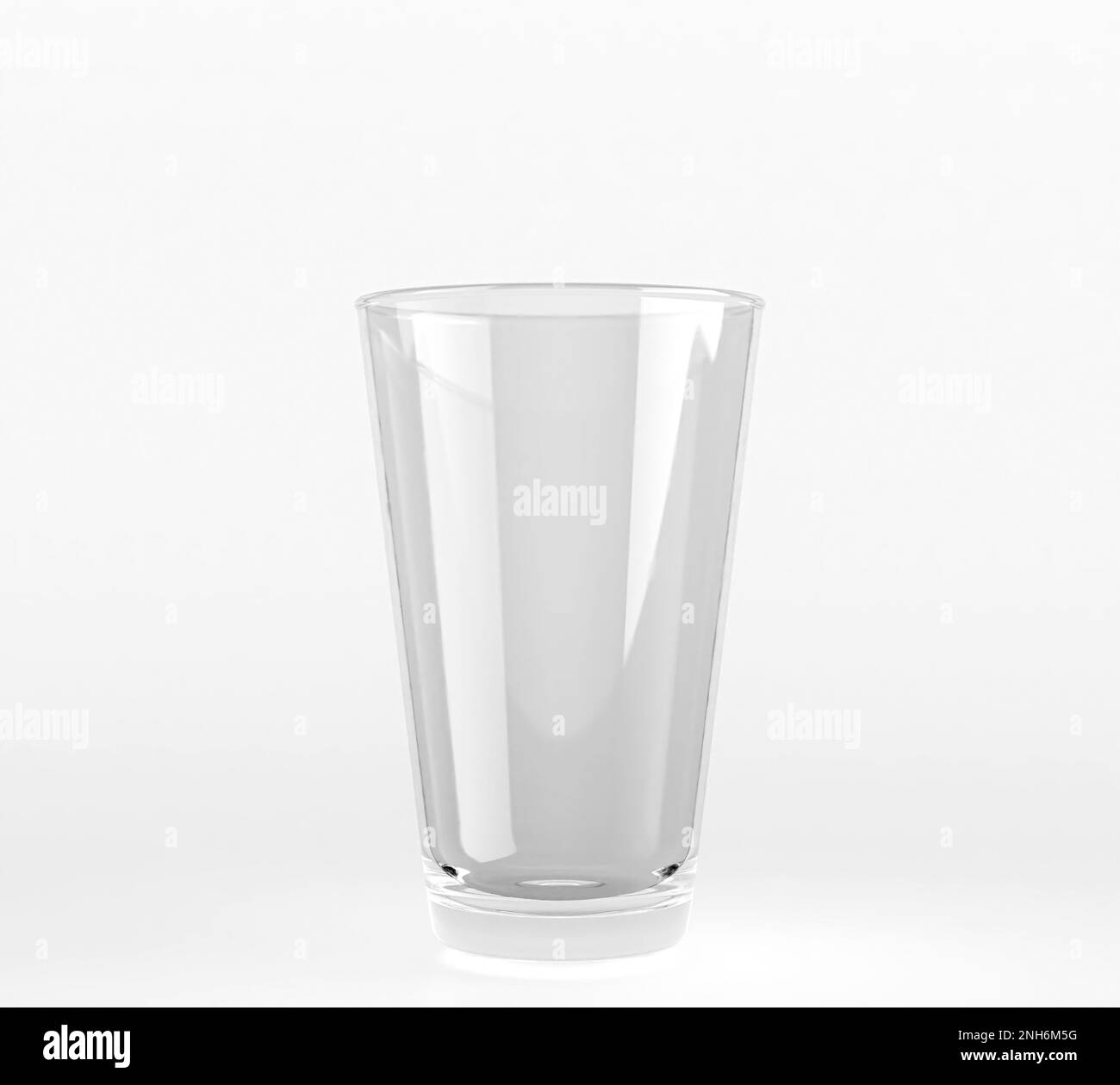 An empty shaker shaped beer glass an isolated white studio background ...