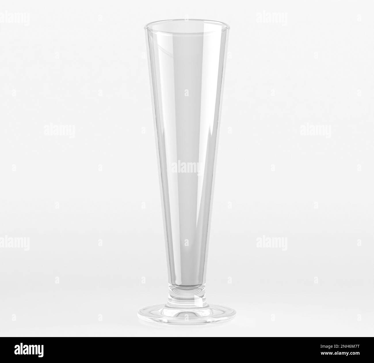 An empty pilsener shaped beer glass an isolated white studio background ...