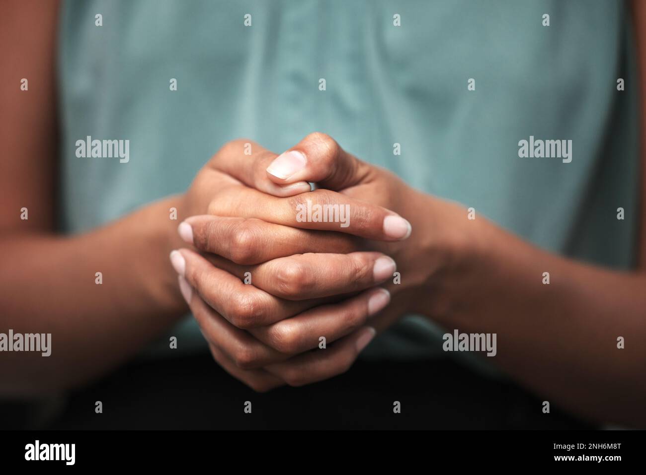 Hands together, anxiety and praying in a psychology therapy session ...