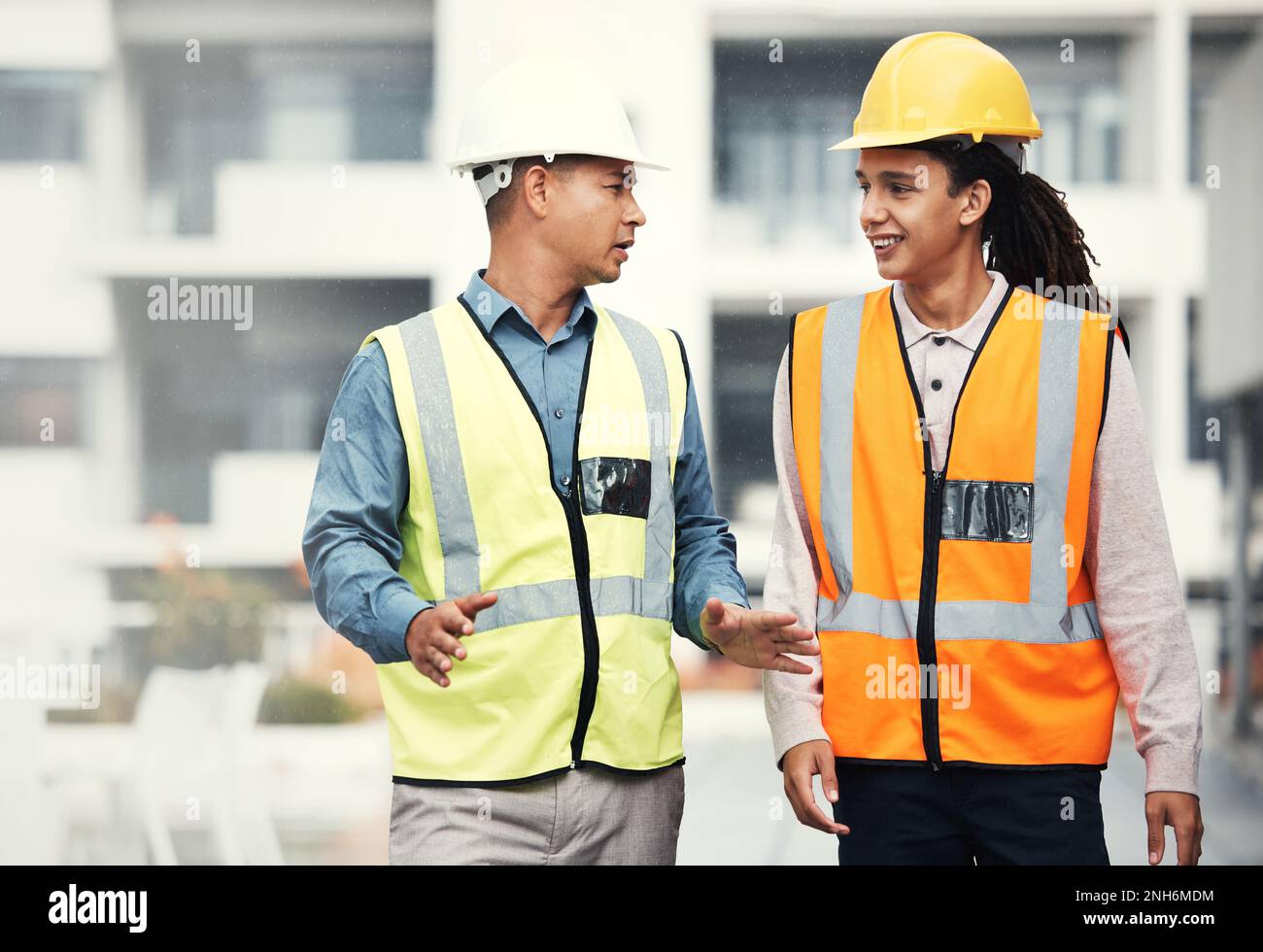 Teamwork, architecture and talking with people on construction site for ...