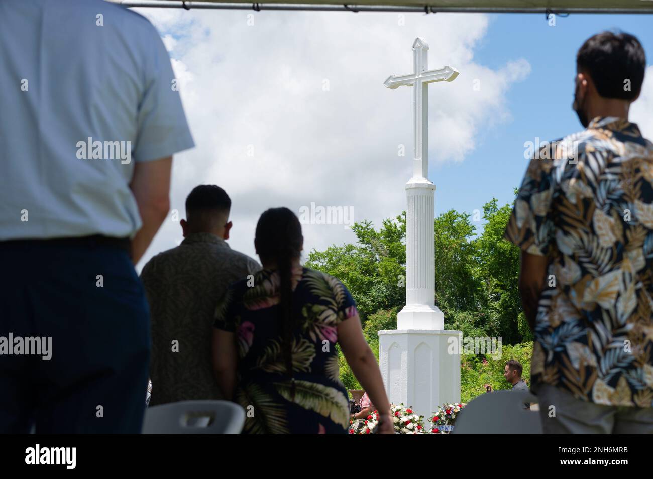 Spectators watch as the Sumay Memorial monument is honored with wreaths ...