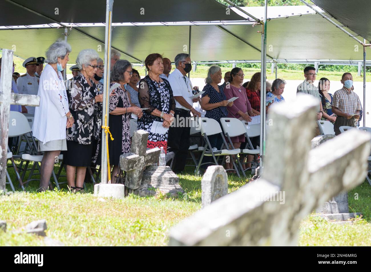 World War II survivors sing the Guam Hymn during the Sumay Memorial ...