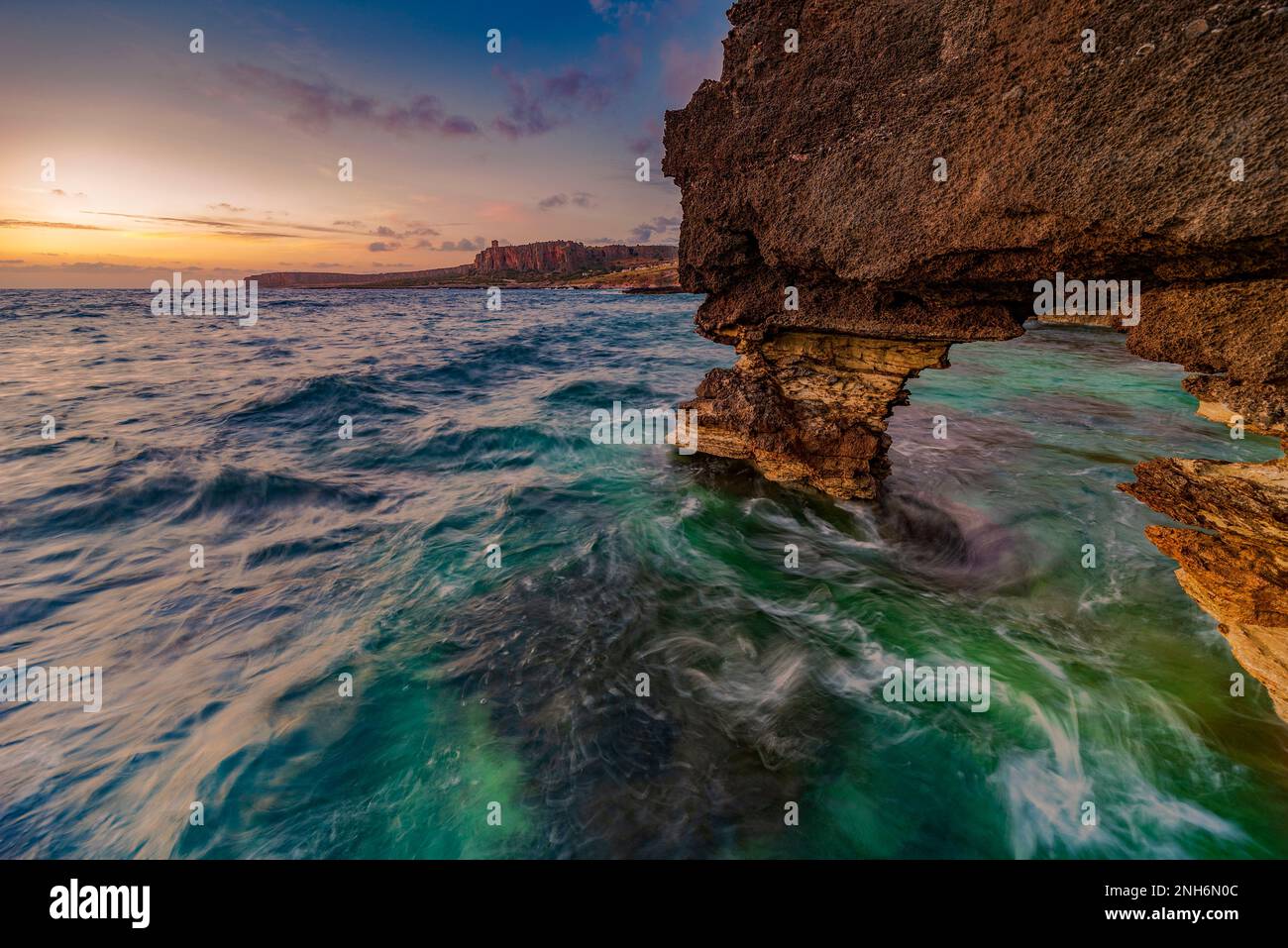 Marine arch in Macari bay at dusk, Sicily Stock Photo - Alamy
