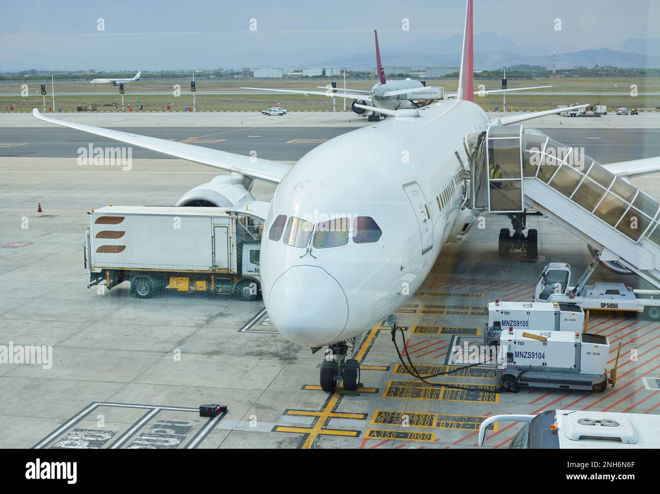 International airport, runway and airplane terminal for travel ...