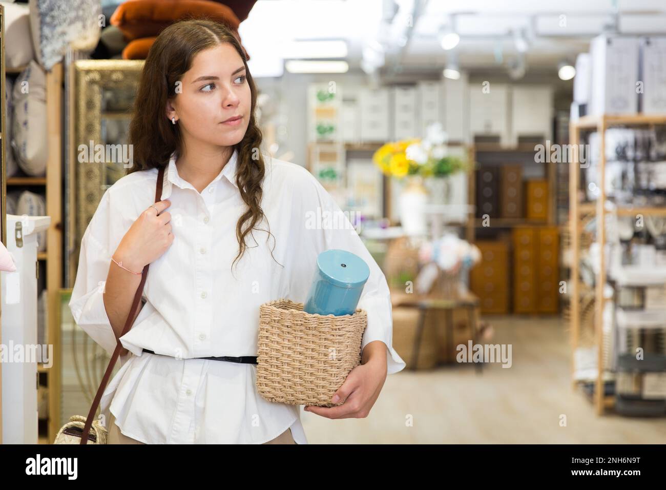 Serious young customer choosing goods hi-res stock photography and ...