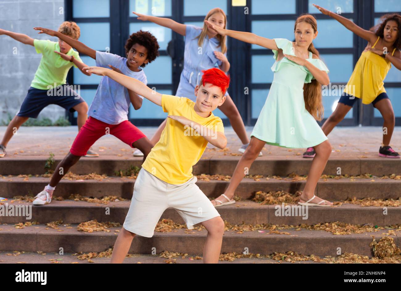 Group of kids performing street dance outdoors Stock Photo - Alamy