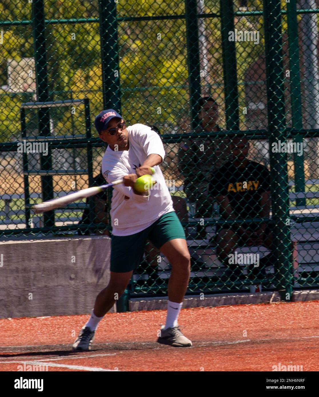 A U.S. Army Soldier assigned to the 7th Infantry Division hits a ball ...
