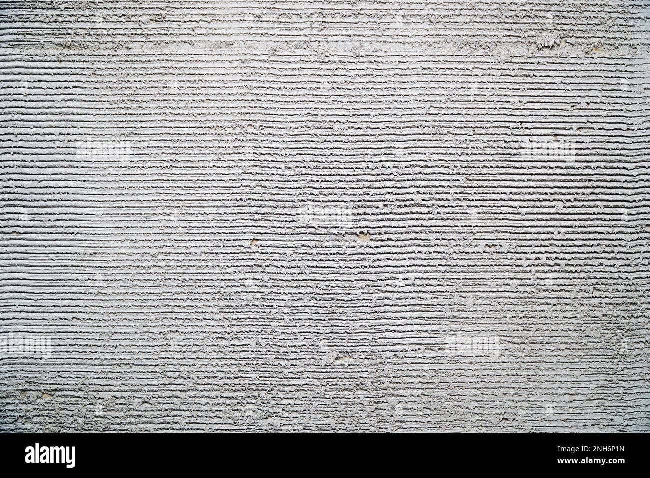 Gray decorative plaster on the wall with pressed horizontal stripes ...