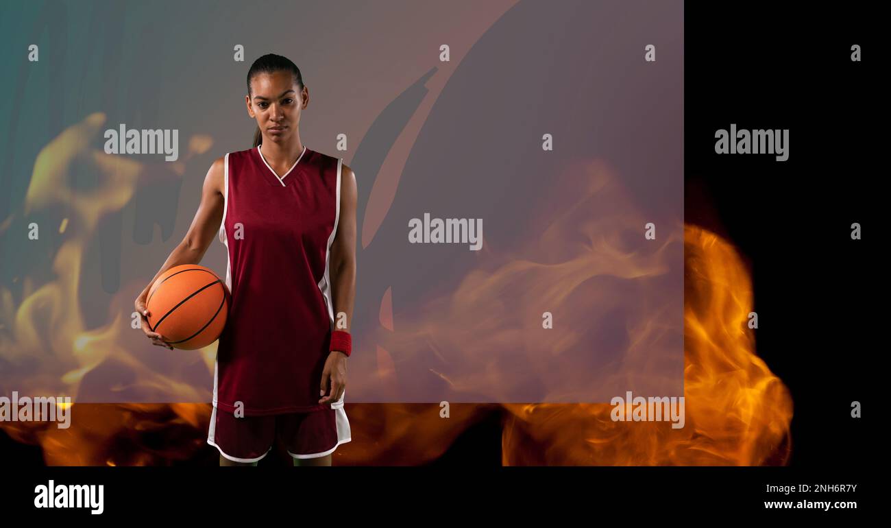 Composition of female basketball player standing holding ball, over ...