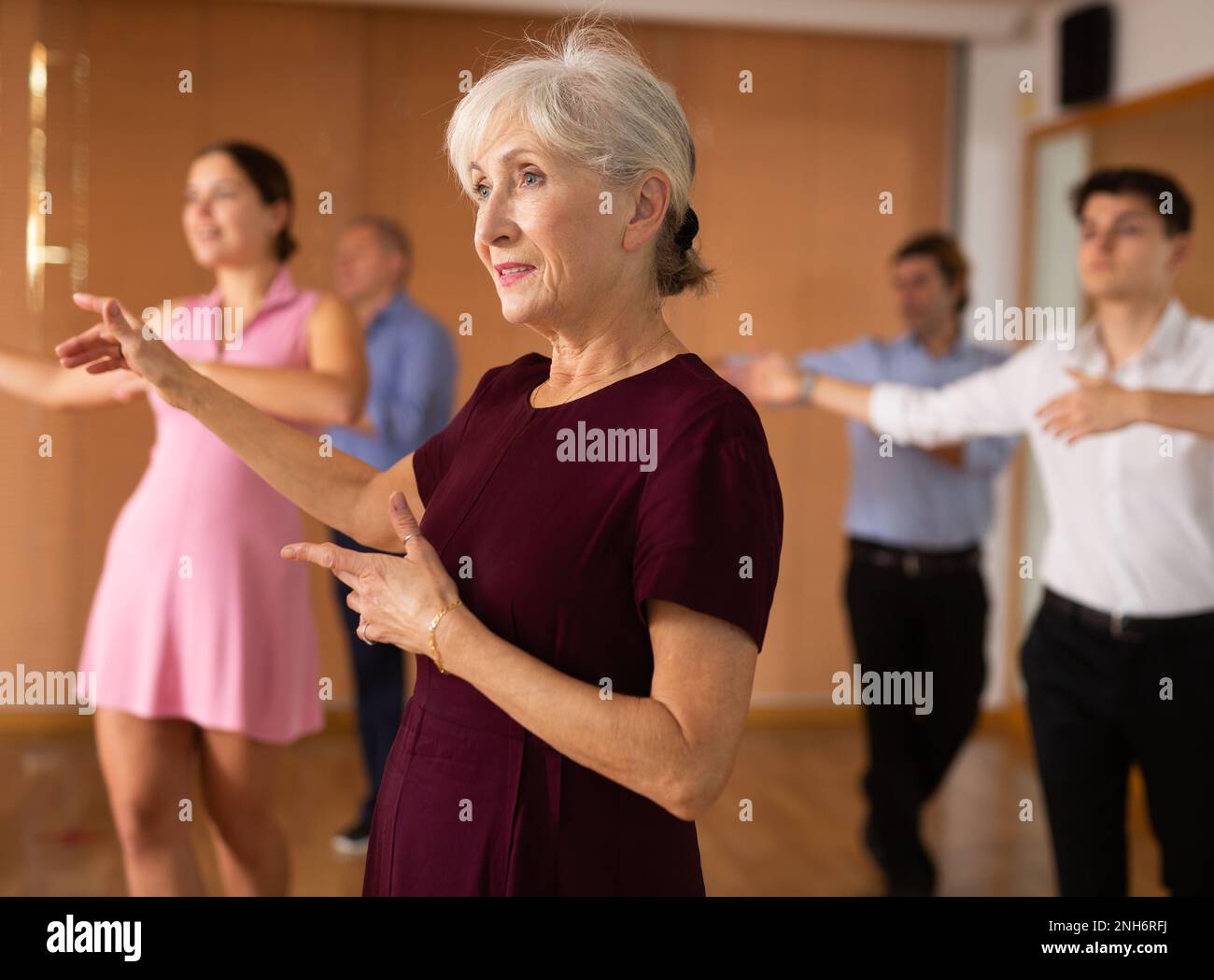 Woman practicing ballroom dance pose in dance studio Stock Photo - Alamy