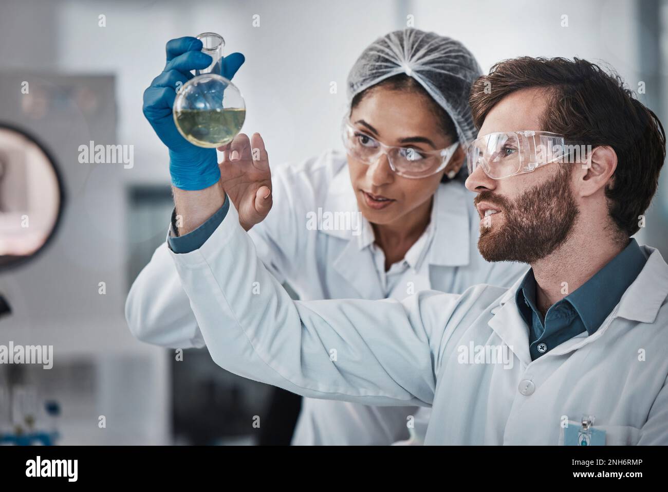 Medical, team work or scientists in laboratory with chemical liquid ...