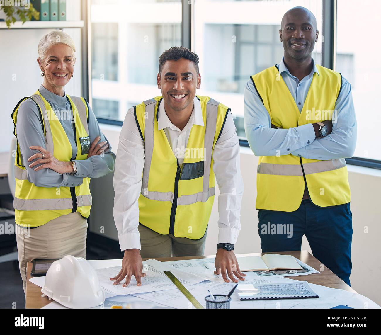 Team, portrait and engineering management staff with construction gear and project blueprint ...