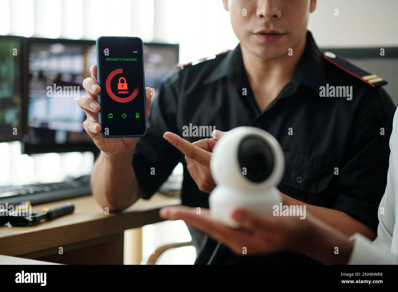 Guard showing manager new security control application for smartphone ...
