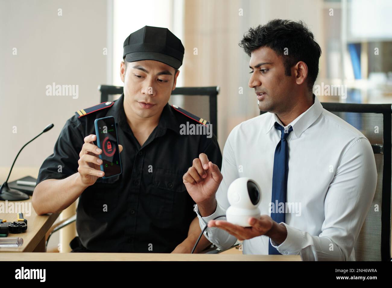 Security guards testing new application for surveillance camera Stock ...