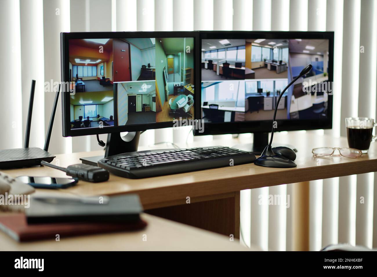 Desk with monitors in office of security guard Stock Photo - Alamy