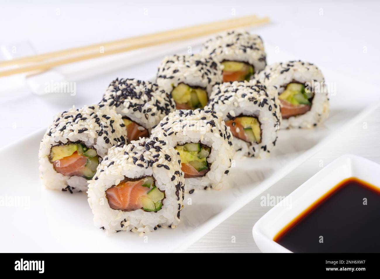 Sushi roll California with salmon, sesame seeds, avocado, cream cheese ...