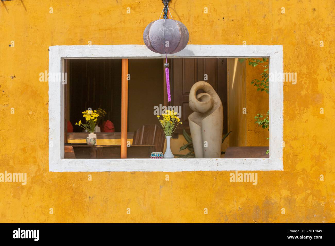 An open window in a yellow wall in Hoi An, Vietnam Stock Photo - Alamy