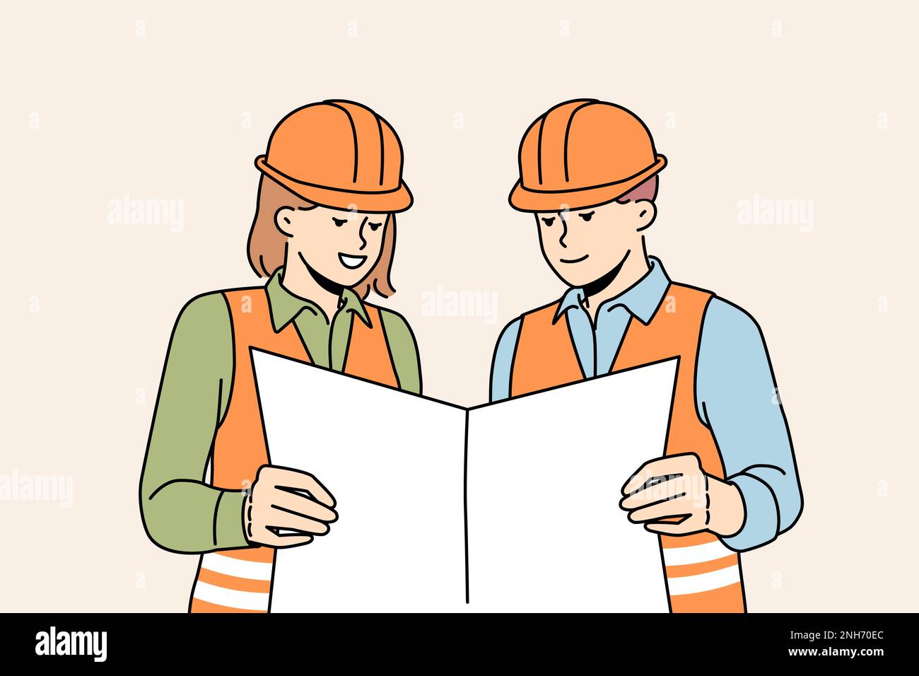 Smiling engineers in helmets study blueprint at site. Man and woman ...