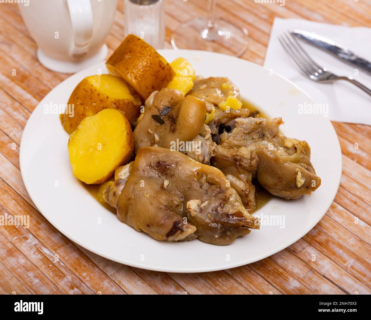 Stewed pig trotters with potato, homemade dinner Stock Photo - Alamy