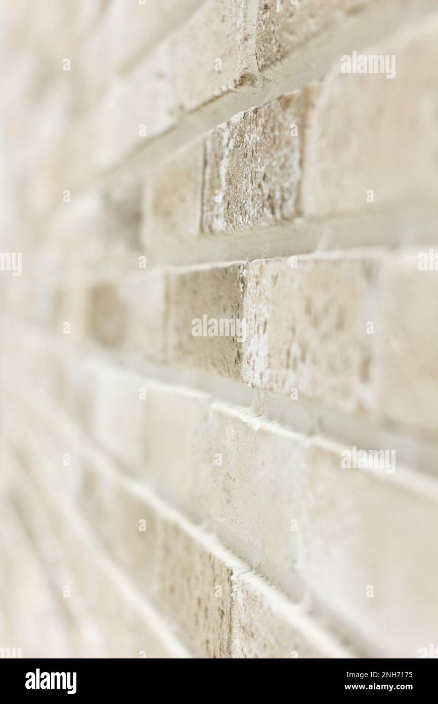 Professionally installed light brown Ornamental brick wall forms part ...