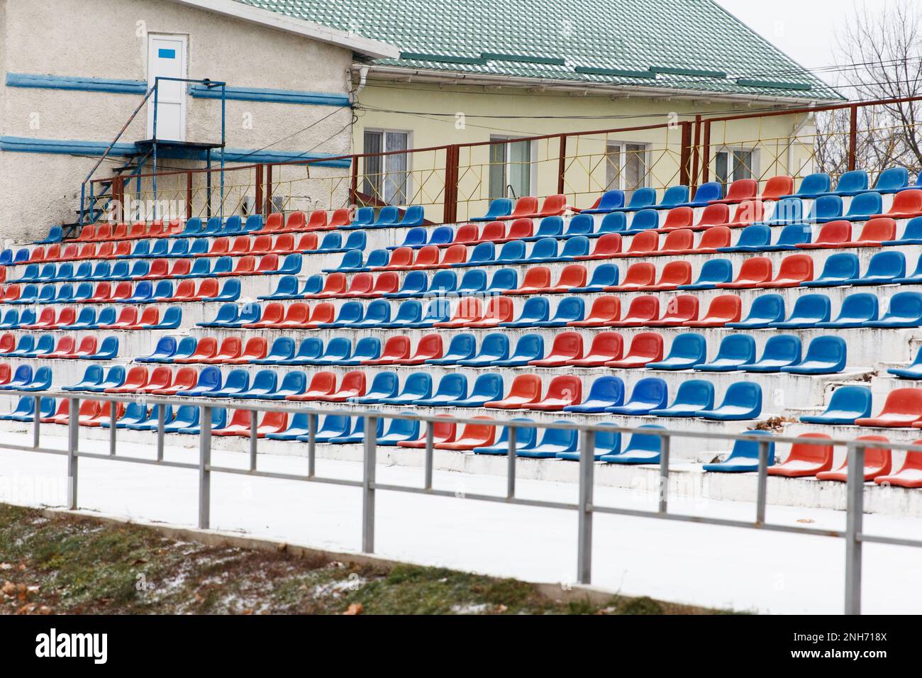 Places where fans sit, plastic chairs in a football stadium, in winter ...