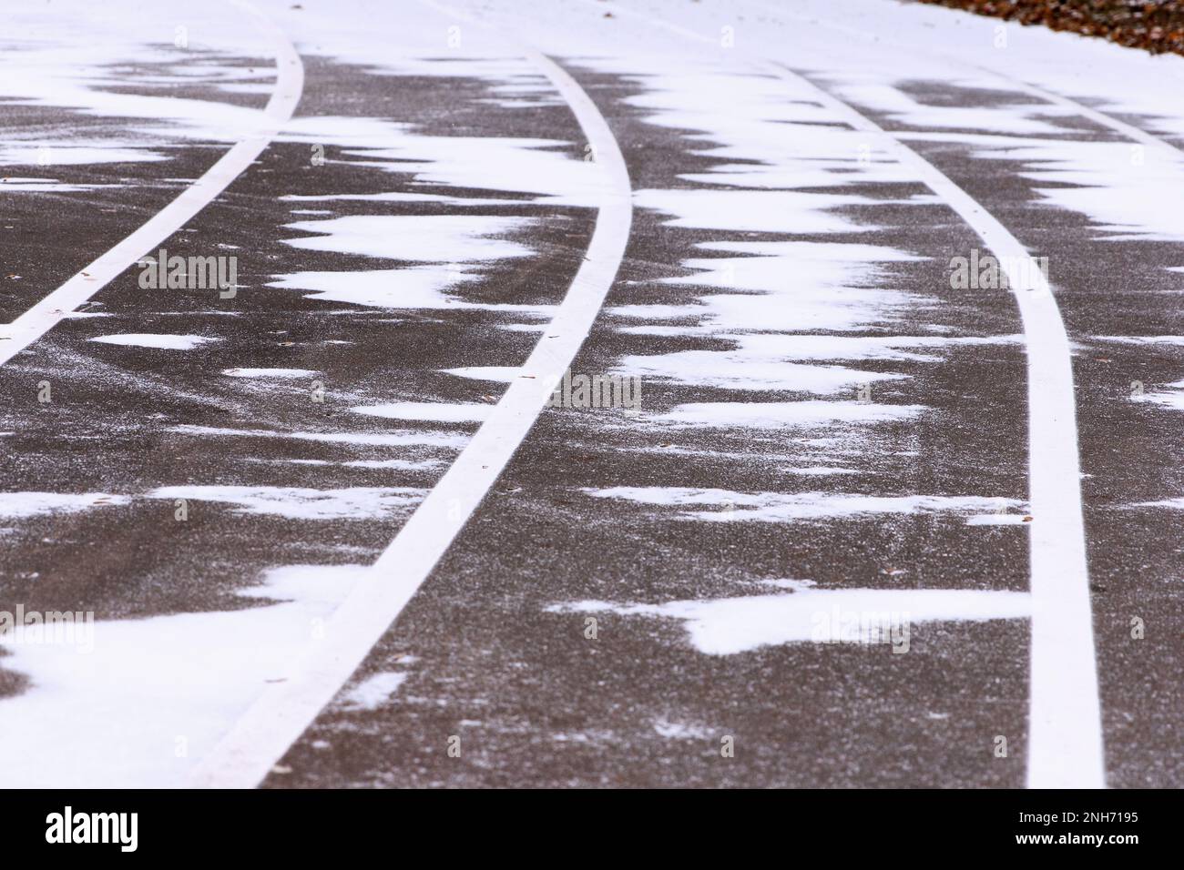 Treadmill, paved, with markings for runner athletes. In winter in snowy ...