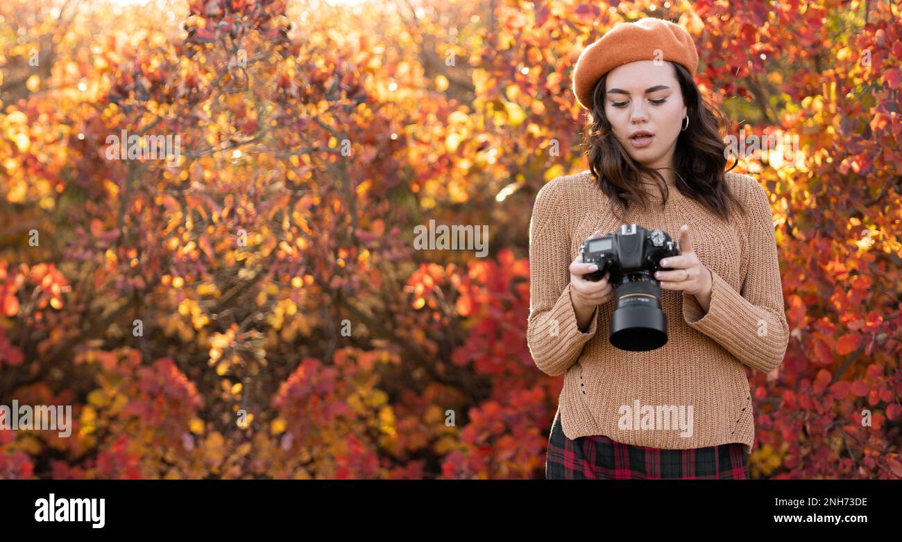 Woman photographer photographing autumn landscape hi-res stock ...