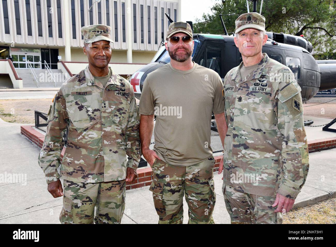 Country artist Drake White, center, poses with the U.S. Army Medical ...