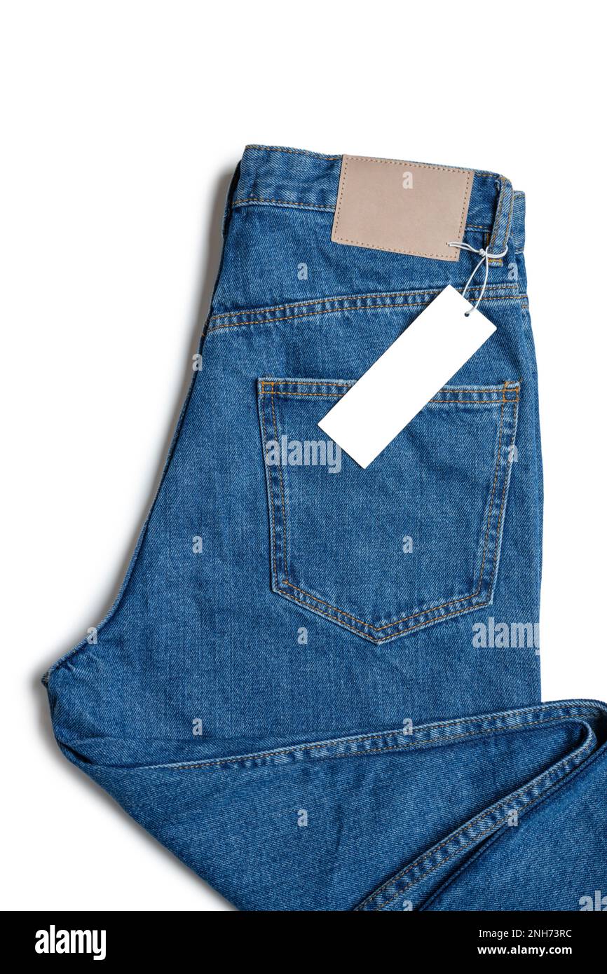 Blue jeans pants and price tag isolated on white background. Denim ...