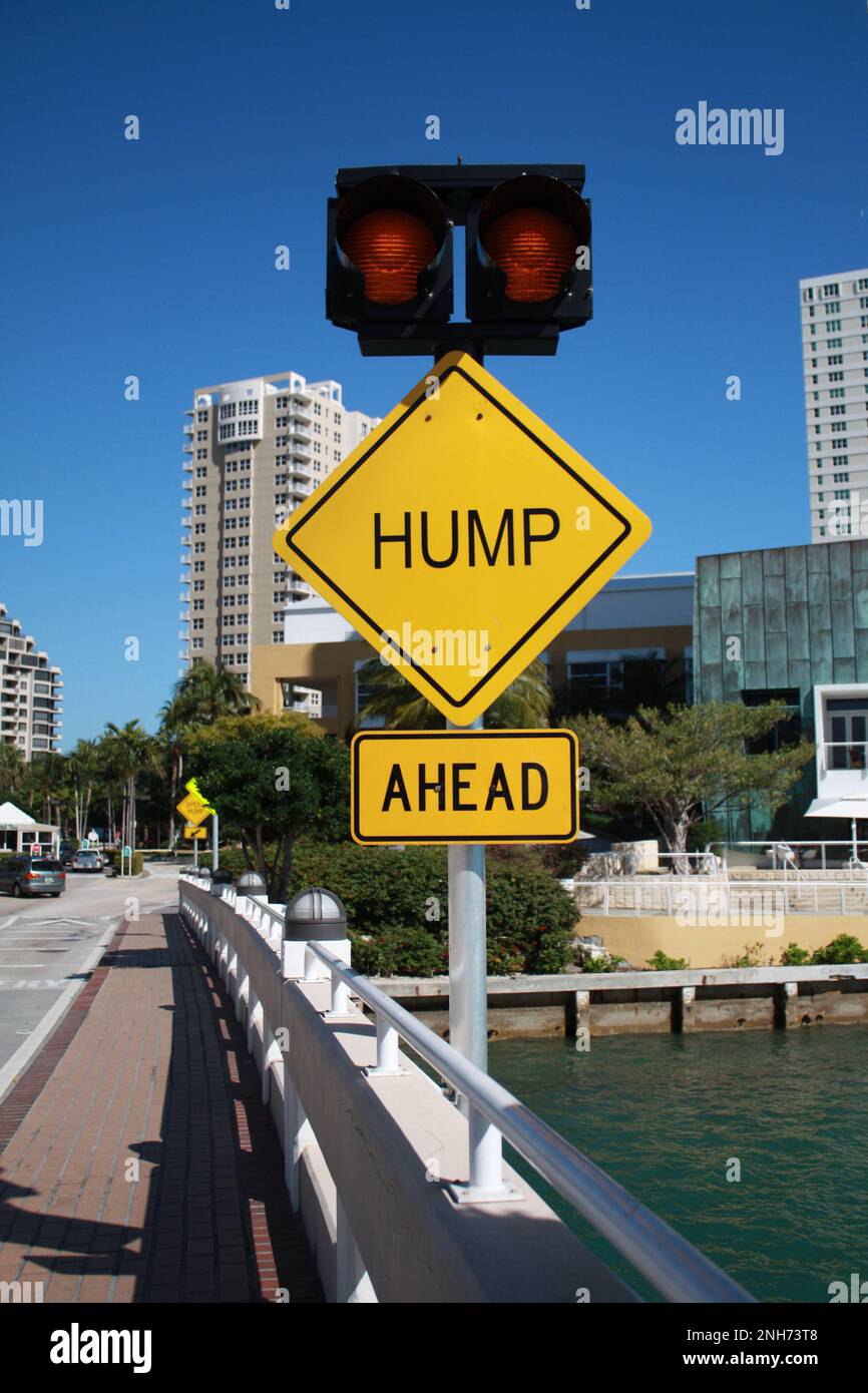 A warning sign of a hump in the road in downtown Miami, Florida USA ...